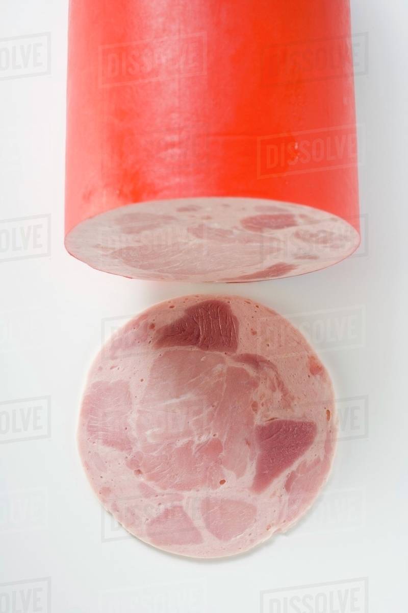 Schinkenwurst (ham sausage) with a slice cut - Royalty-free Stock Photo ...