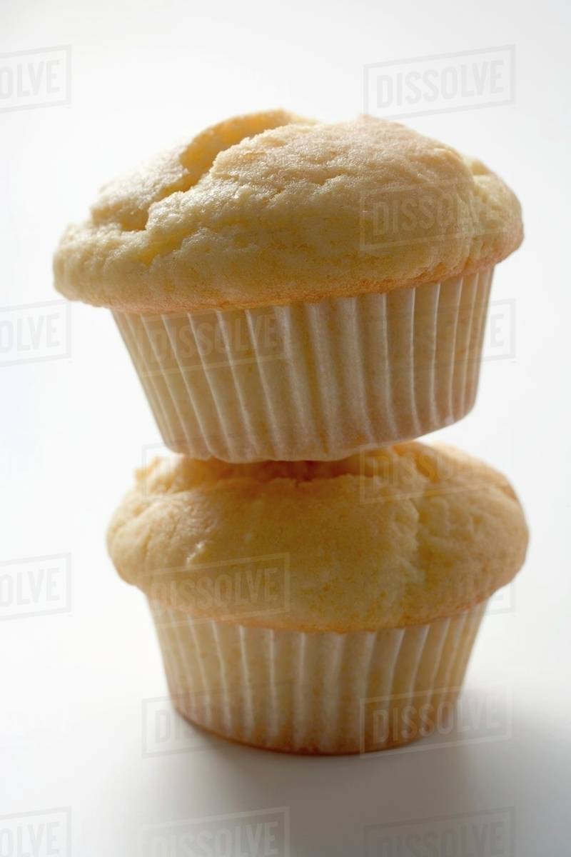 Two muffins in paper cases - Royalty-free Stock Photo | Dissolve