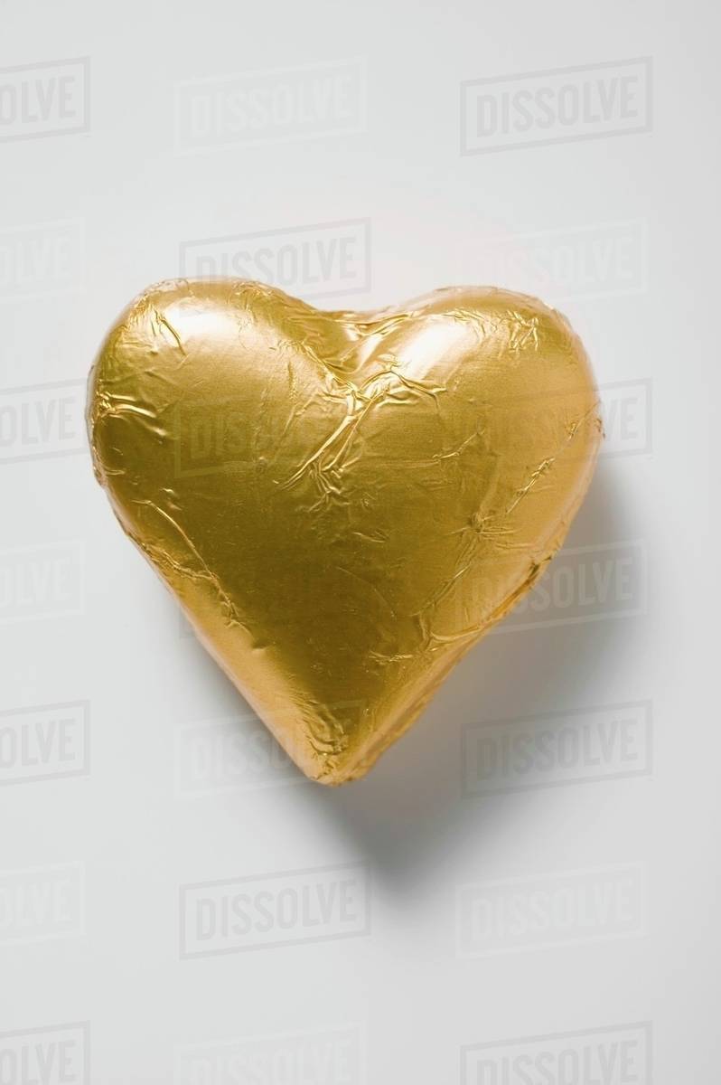 Chocolate heart in gold foil - Royalty-free Stock Photo | Dissolve