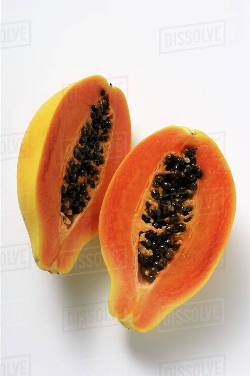 Two papaya halves - Royalty-free Stock Photo | Dissolve