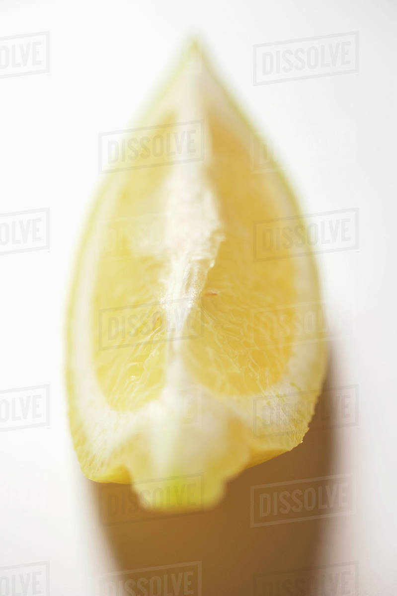Wedge of lemon - Stock Photo - Dissolve