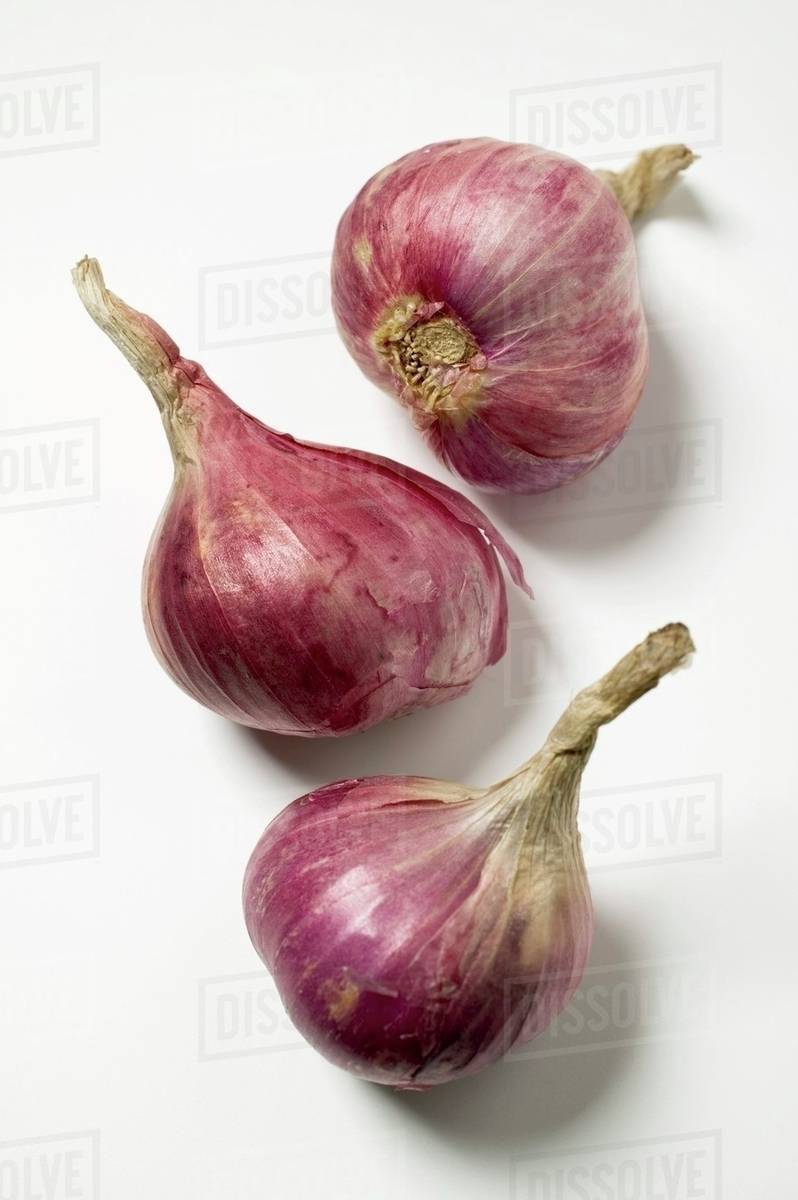 Three red onions - Royalty-free Stock Photo | Dissolve