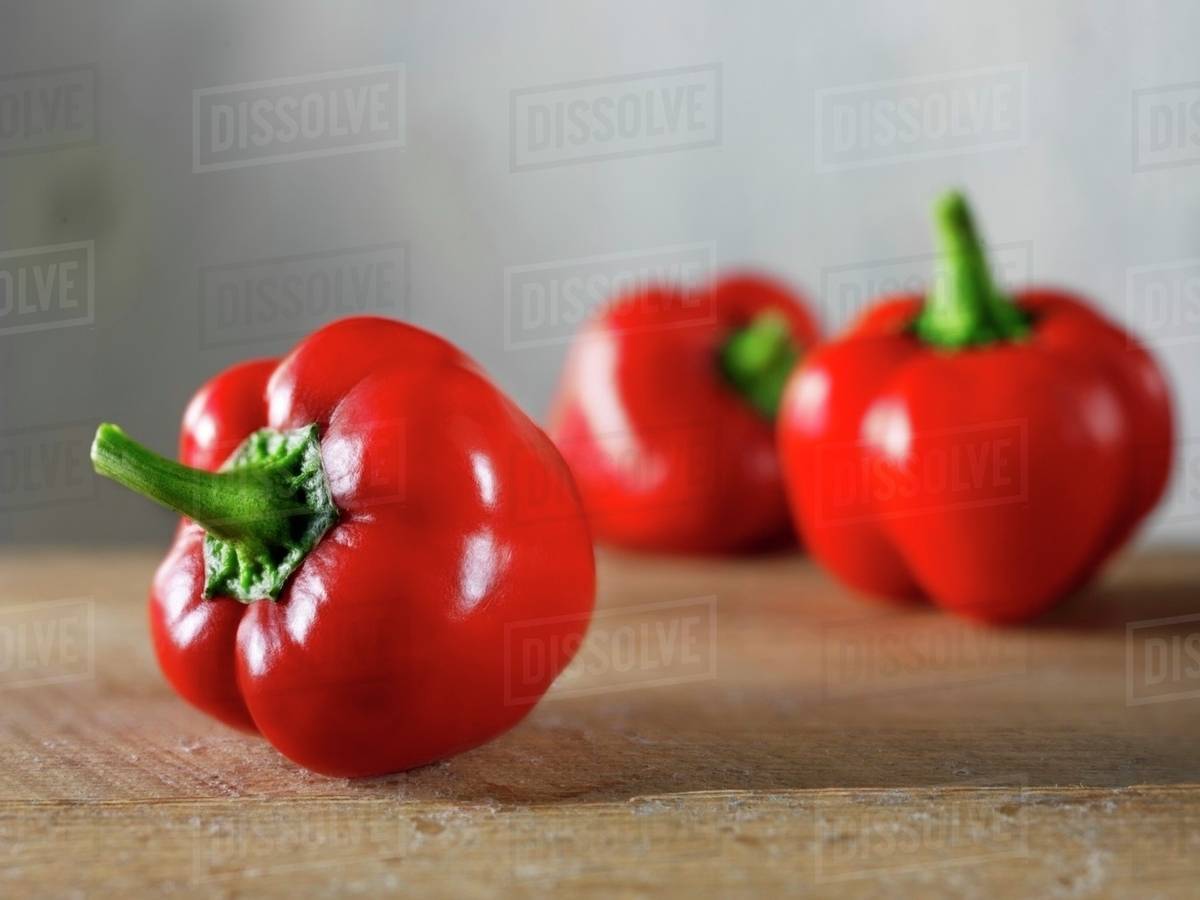 Three red peppers - Royalty-free Stock Photo | Dissolve