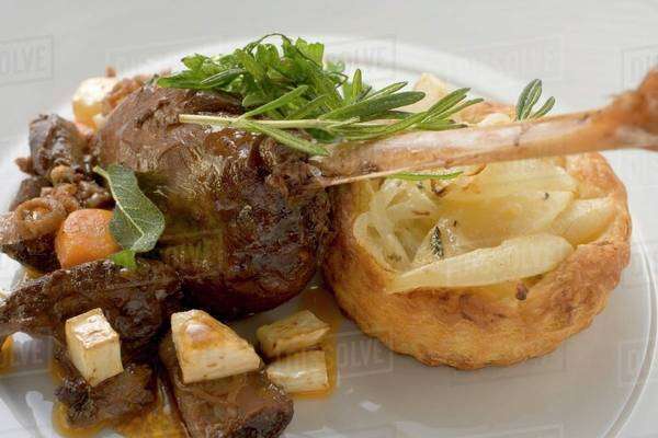 Braised goose leg with pear and onion tart - Royalty-free Stock Photo ...