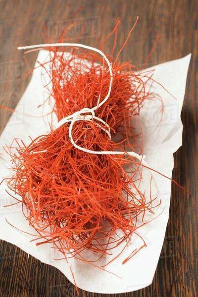 Saffron threads, tied together - Royalty-free Stock Photo | Dissolve
