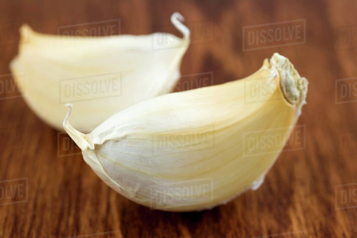 Two cloves of garlic - Stock Photo - Dissolve