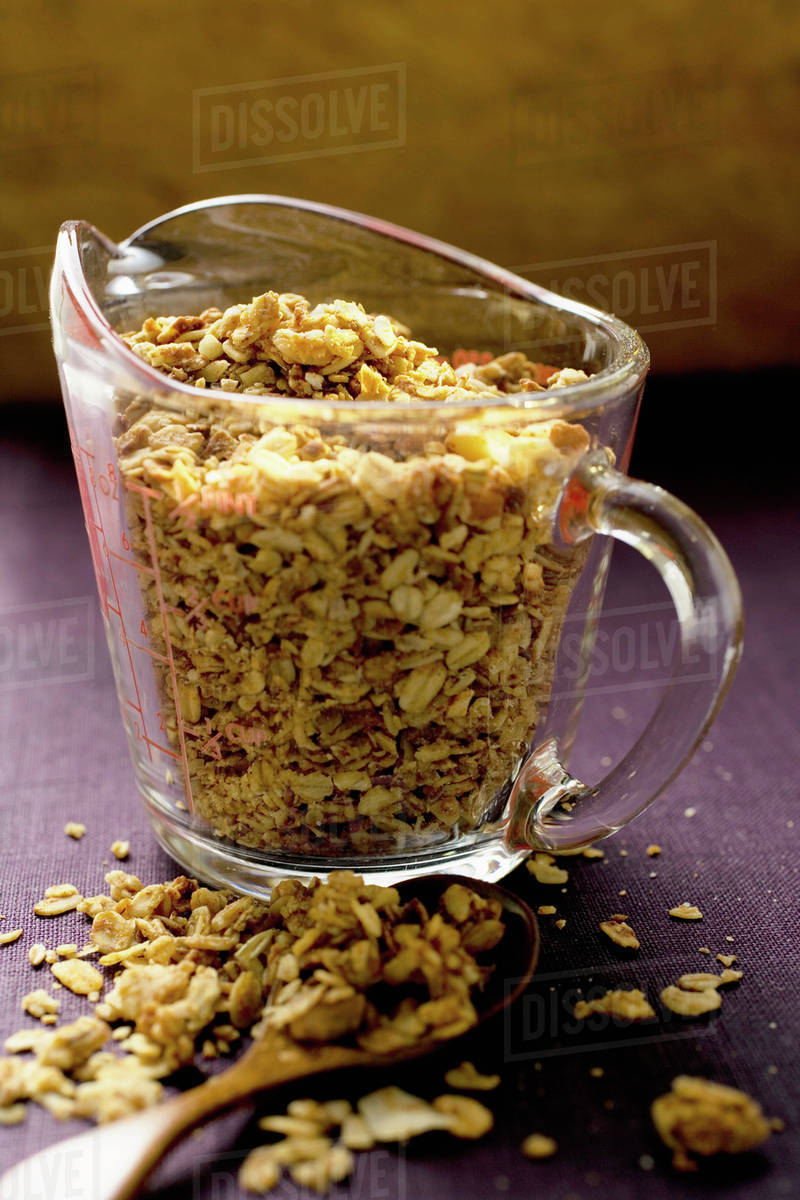 Crunchy muesli in a measuring jug - Stock Photo - Dissolve