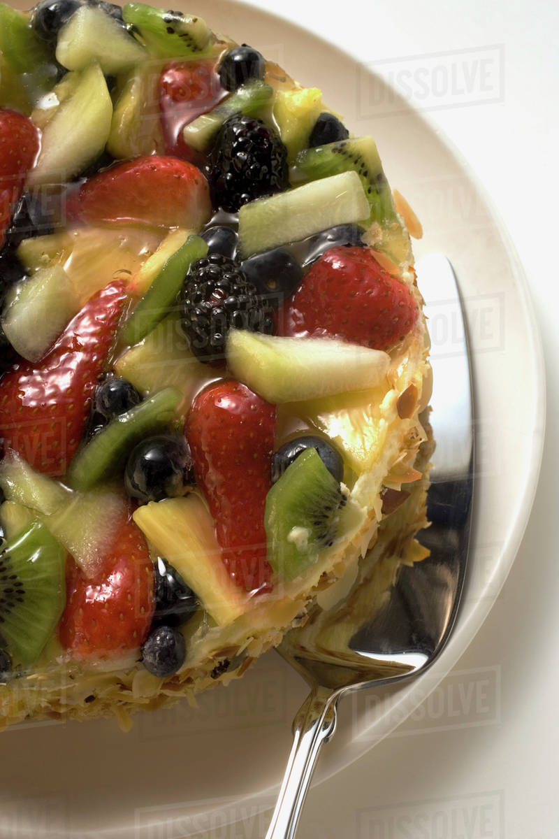 Fruit gateau with cake slice - Royalty-free Stock Photo | Dissolve