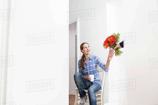 Human hand giving bunch of flowers to woman, smiling - Stock Photo ...