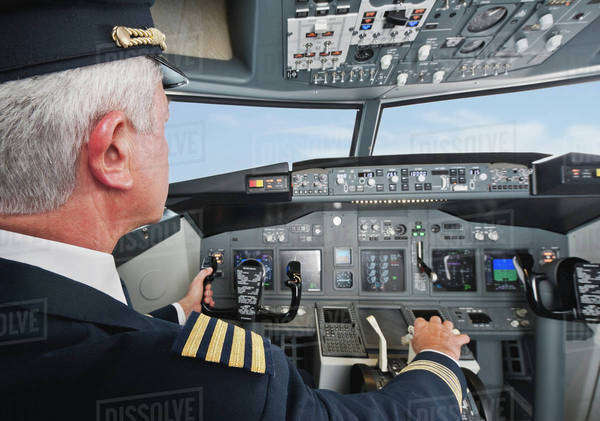 Germany, Bavaria, Munich, Senior flight captain piloting aeroplane from ...