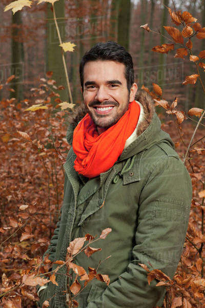 Germany, Berlin, Wandlitz, Young man smiling, portrait - Stock Photo ...
