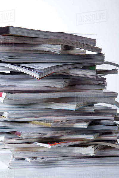 Piled magazines, close-up - Stock Photo - Dissolve