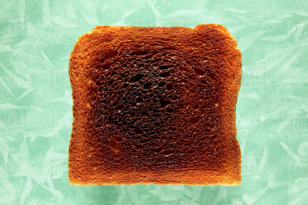 Slice of toast, close-up, elevated view - Stock Photo - Dissolve