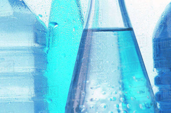 Mid section of cold bottled water - Stock Photo - Dissolve