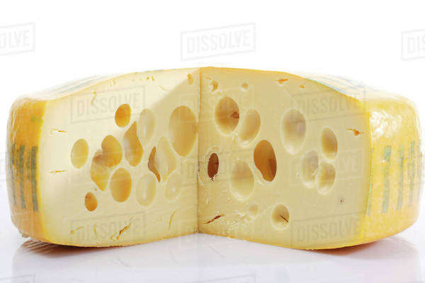 Block of Swiss cheese, close-up - Stock Photo - Dissolve