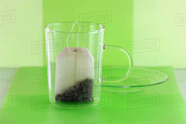 Empty tea glass with tea bag - Stock Photo - Dissolve