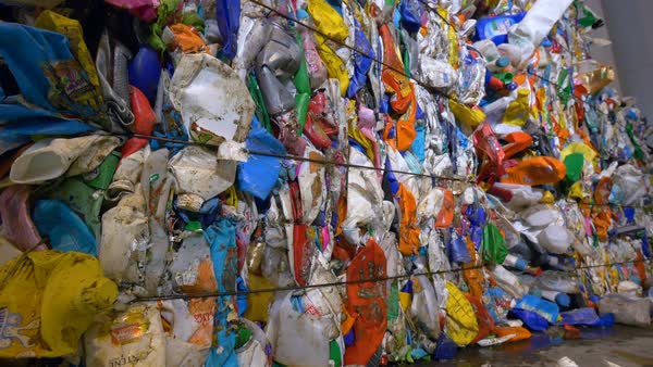 Pet bottle ready for recycling in a garbage sorting center. Dolly shot ...