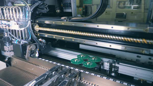 Mechanical device is moving rapidly while assembling circuits - 4K ...