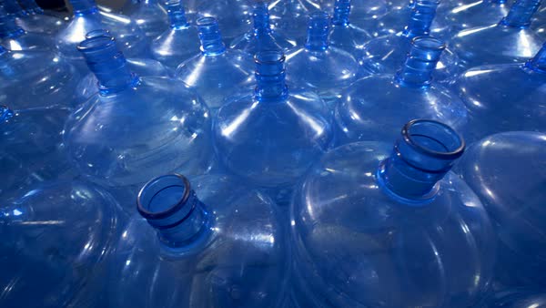 Stack of large 5 gallon water jugs at a factory - 4K Royalty-free Stock ...