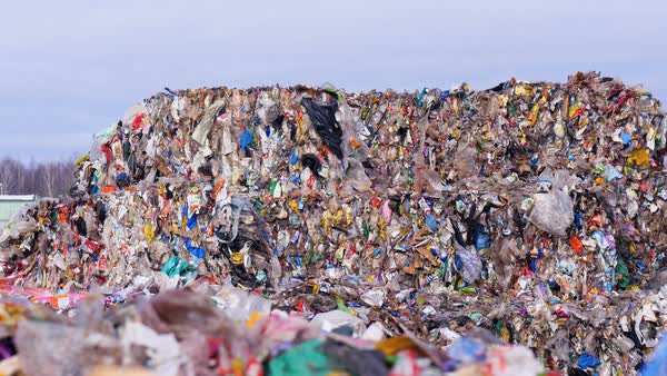 Lots of plastic, waste garbage at landfill site. Urban refuse dump ...