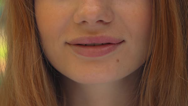 Details front view lips smiling redhead young woman with friendly smile ...