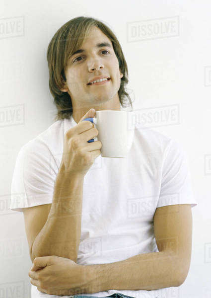 Man with coffee cup - Stock Photo - Dissolve