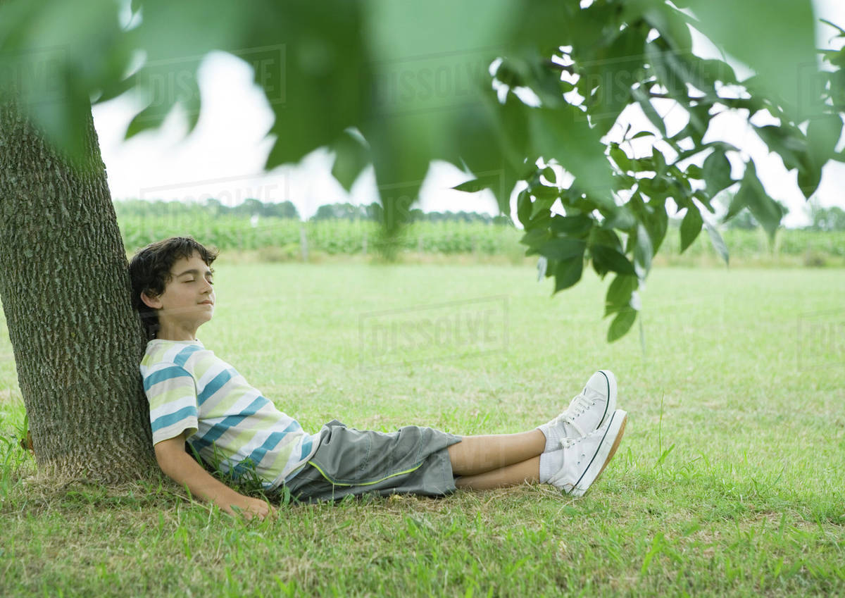 Pose Leaning Against Tree