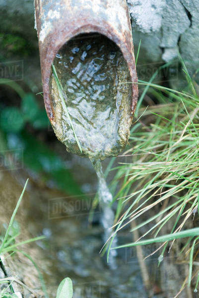 Water running out of pipe - Stock Photo - Dissolve