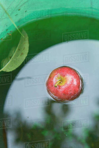 Apple floating in water - Royalty-free Stock Photo | Dissolve
