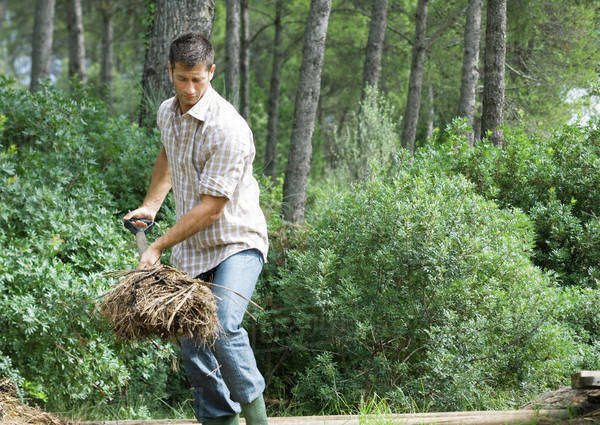 Man doing yard work - Royalty-free Stock Photo | Dissolve