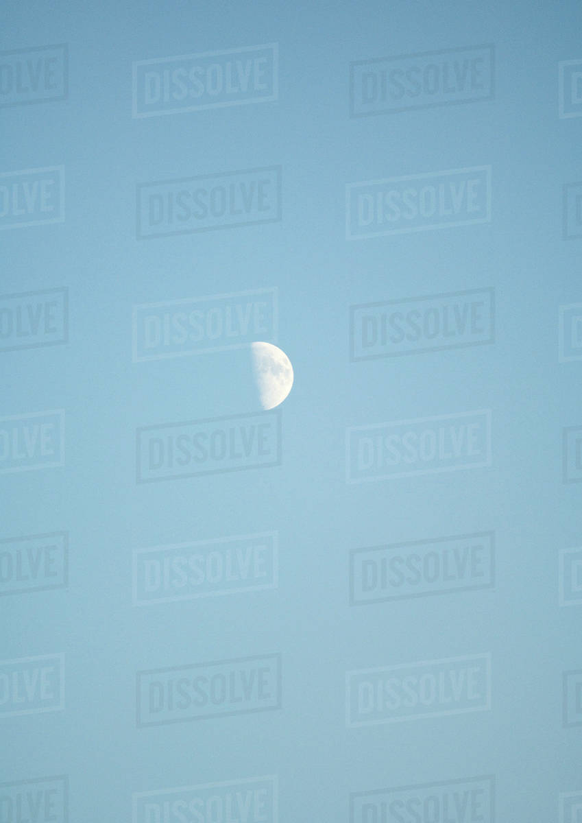 Half moon in blue sky - Royalty-free Stock Photo | Dissolve