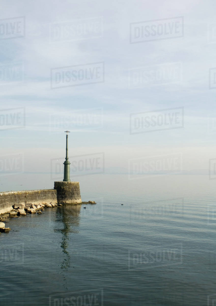 Breakwater with beacon - Royalty-free Stock Photo | Dissolve