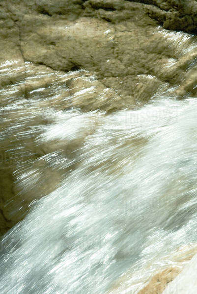 Water running over rock, close-up - Stock Photo - Dissolve