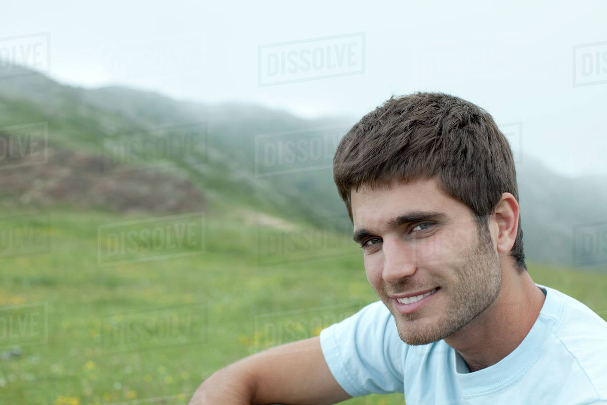 Man in nature, mountains in background, portrait - Royalty-free Stock ...