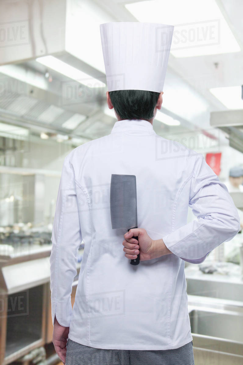 Rear View of Chef with Knife Behind his Back - Royalty-free Stock Photo ...