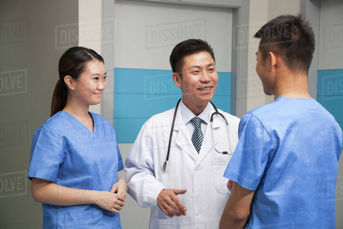 Medical Team Talking In Hospital - Royalty-free Stock Photo | Dissolve