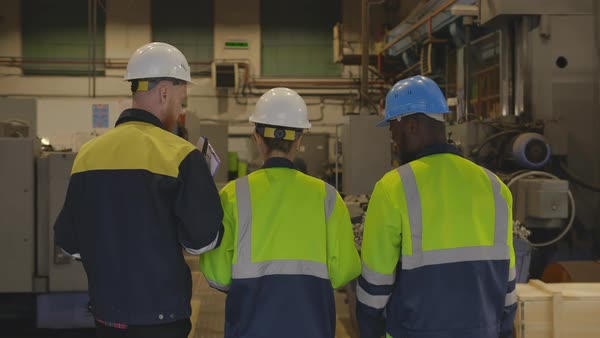 Factory employees team discussing new production plan - 4K Royalty-free ...