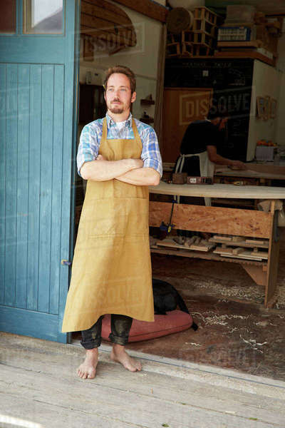 Portrait of carpenter outside bespoke surfboard workshop - Royalty-free ...