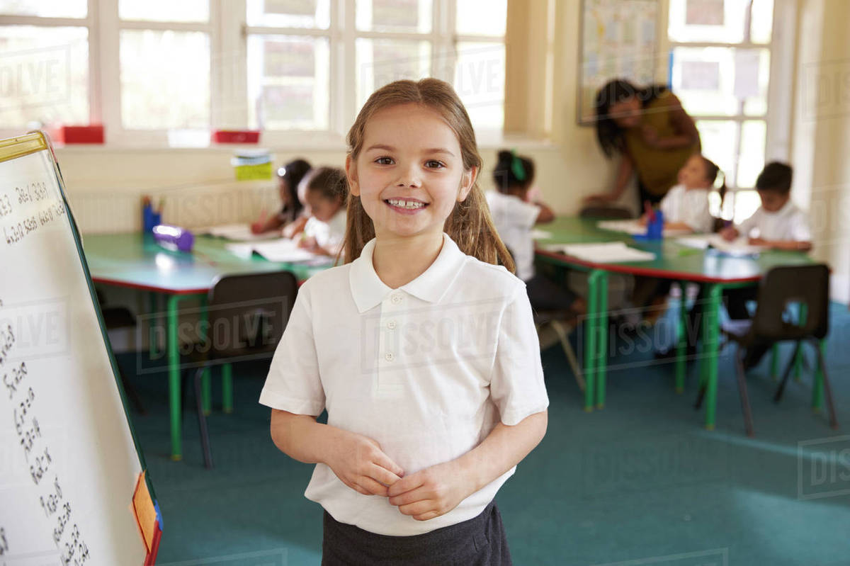 Portrait of elementary school pupil with whiteboard in class - Royalty ...