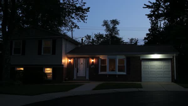 Tilt-down shot of a suburban house at night - Stock Video Footage ...