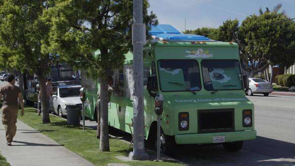 Static shot of a man at a food truck - Stock Video Footage - Dissolve