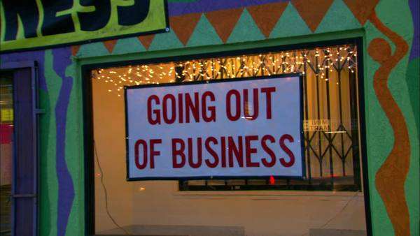 Zooming in shot of a going out of business sign in a store window - HD ...