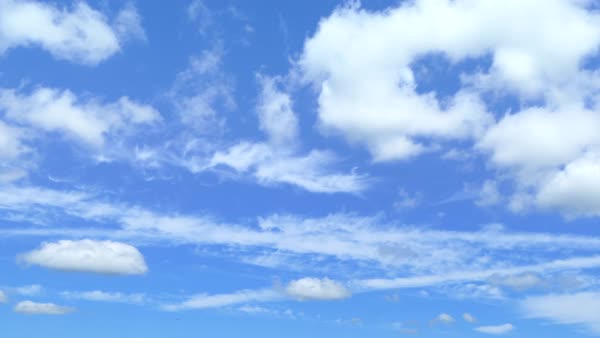 Time lapse clouds moving quickly amid blue skies. Two layers of clouds ...