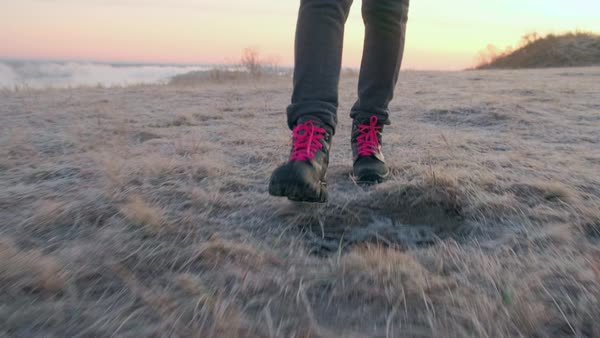 Woman tourist walks into the fog and enjoys nature. - Stock Video ...