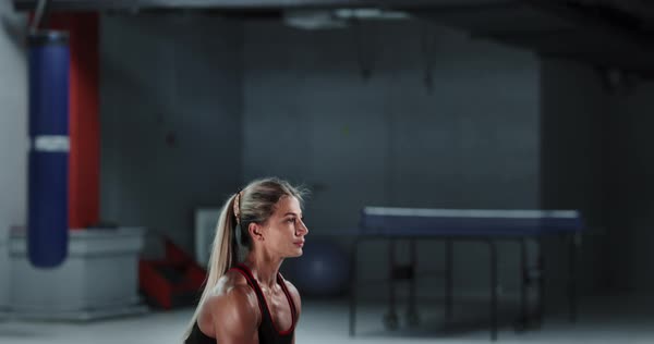 Professional Female Bodybuilder Doing squats exercise.Muscular and ...