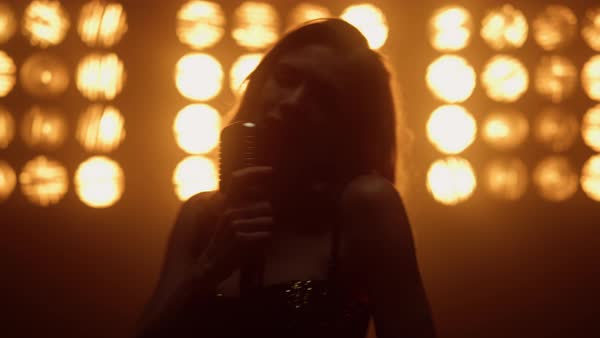 Hot woman performer singing mic in night club closeup. Girl performing ...