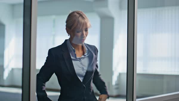 Worried lady boss thinking problem at meeting room alone closeup. Woman ...