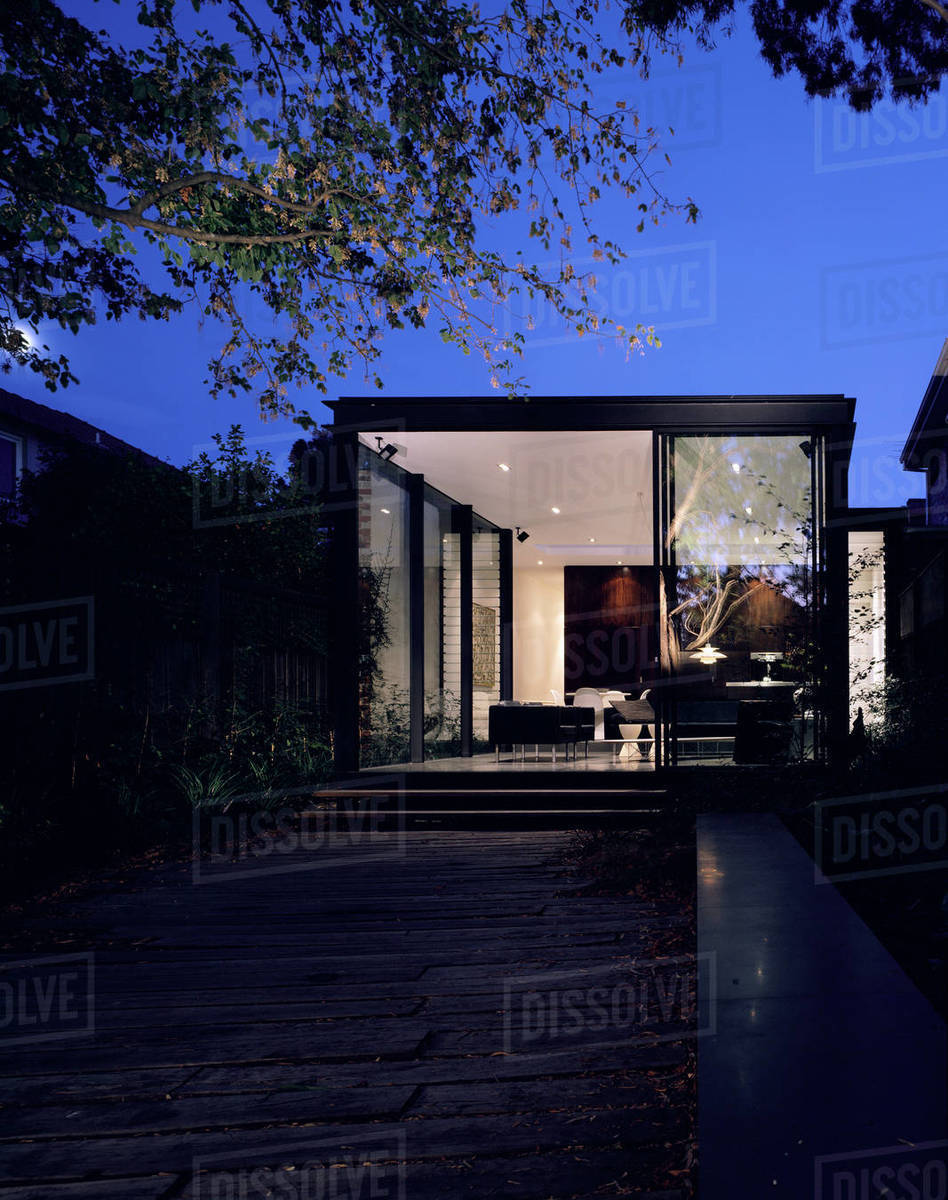 Exterior of a house seen at night with garden - Royalty-free Stock ...