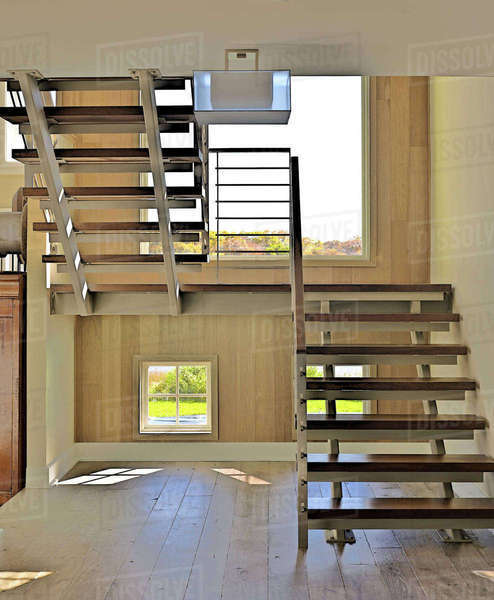 Staircase with open treads in hallway with wooden floor - Royalty-free ...