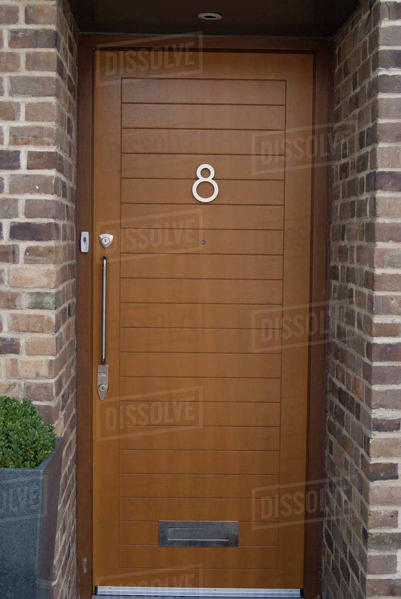 A modern brown front door of a residential house. - Royalty-free Stock ...